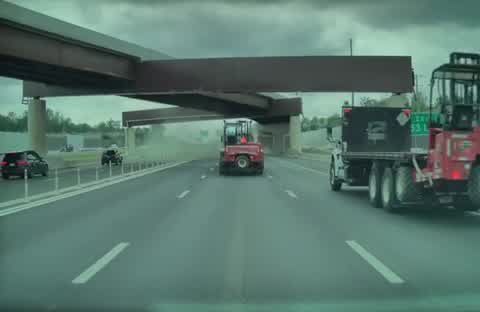 VIDEO: Dump truck’s trailer hits overhead support beam, breaks off ...